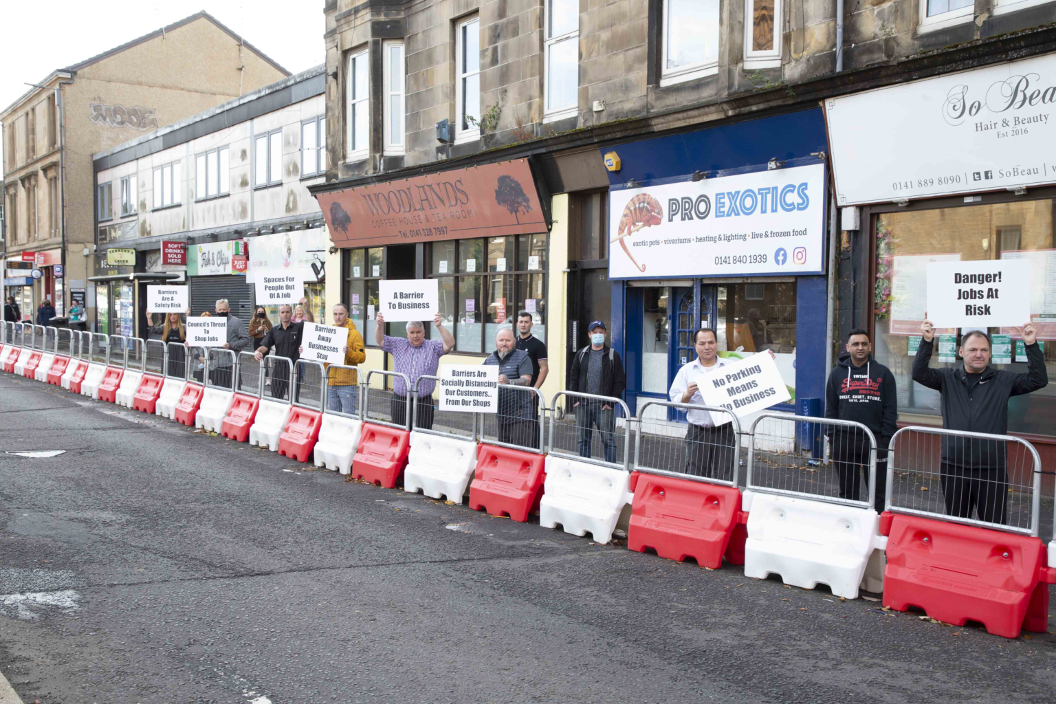 Shopkeepers protest at barriers erected outside their premises ...