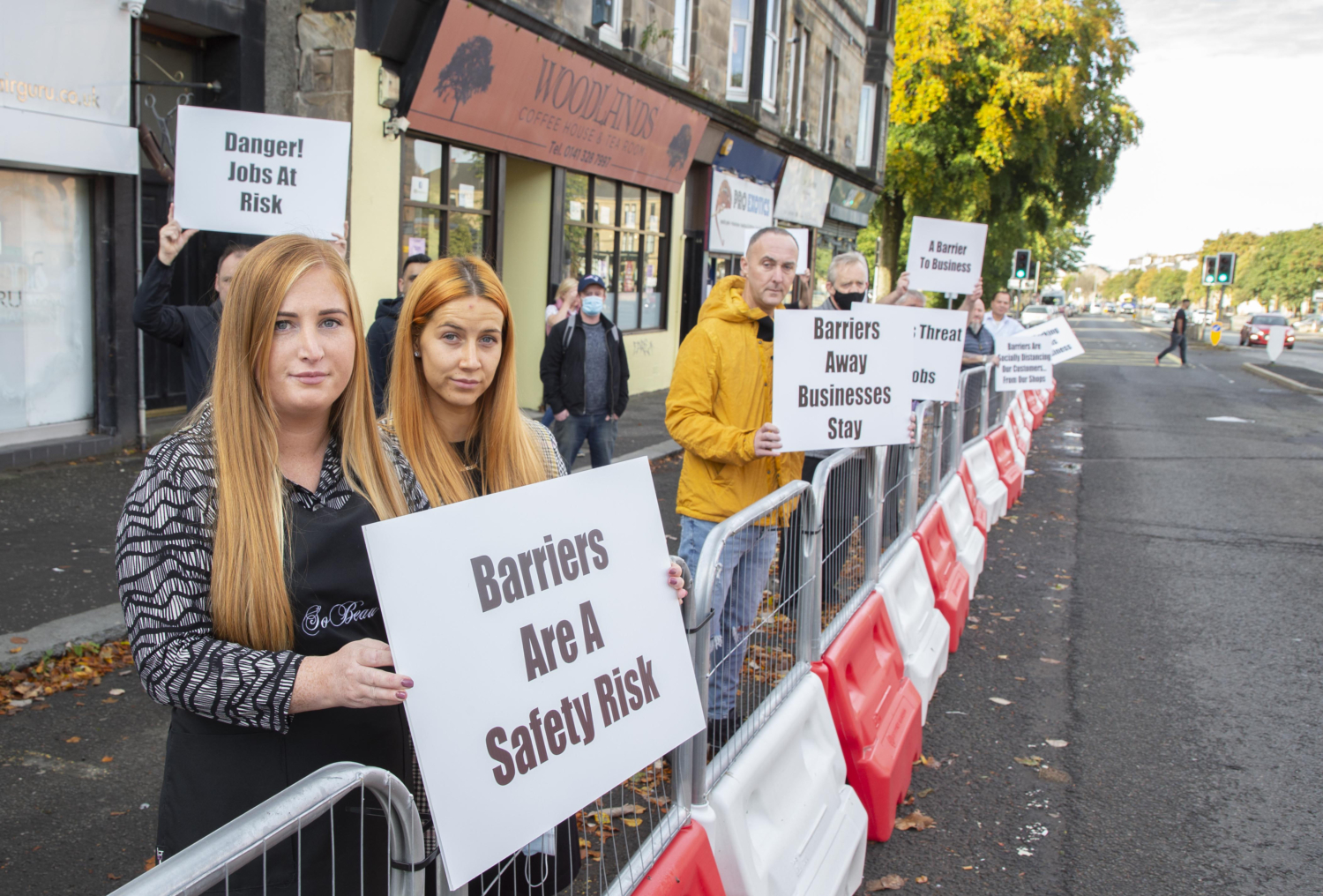 Shopkeepers protest at barriers erected outside their premises ...