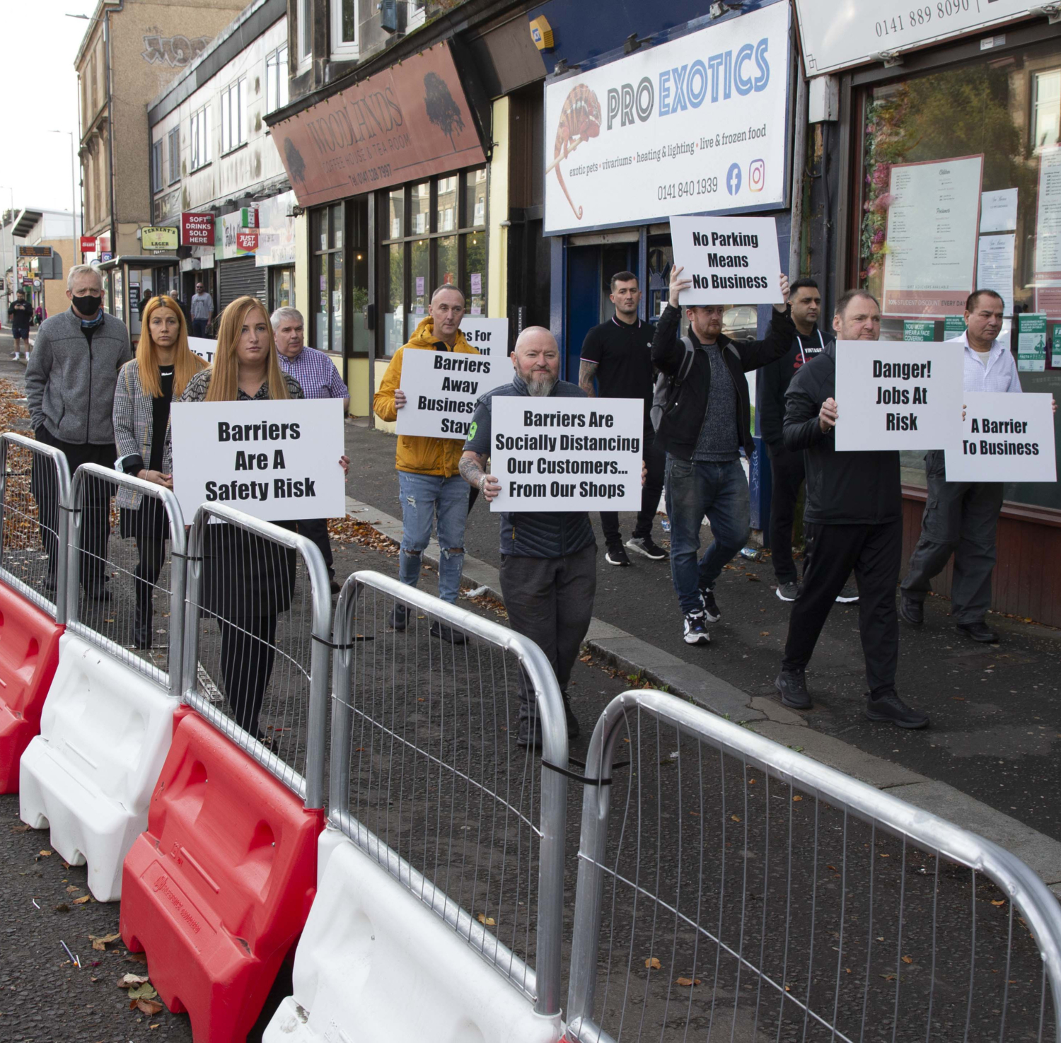Shopkeepers protest at barriers erected outside their premises ...